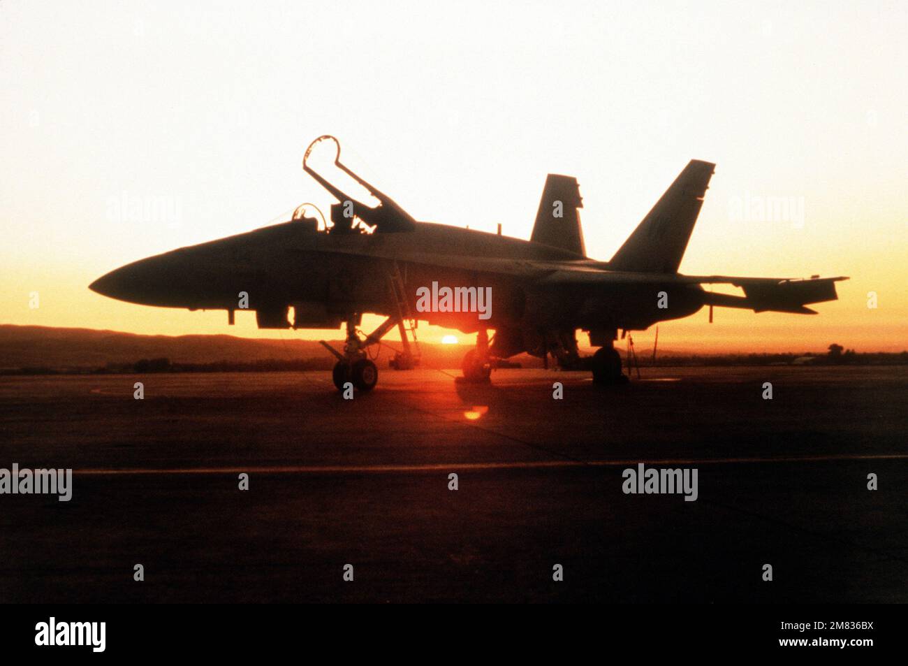 Left side view of a parked F/A-18 Hornet strike fighter aircraft from ...