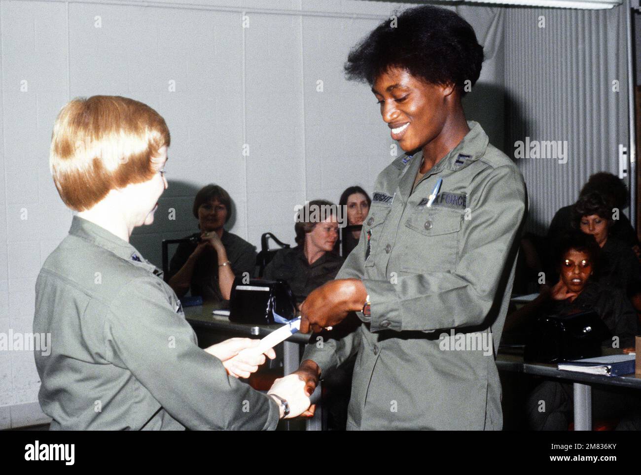 CAPT. Sharon B. Wright, right, receives her diploma from LT. COL. Terry ...