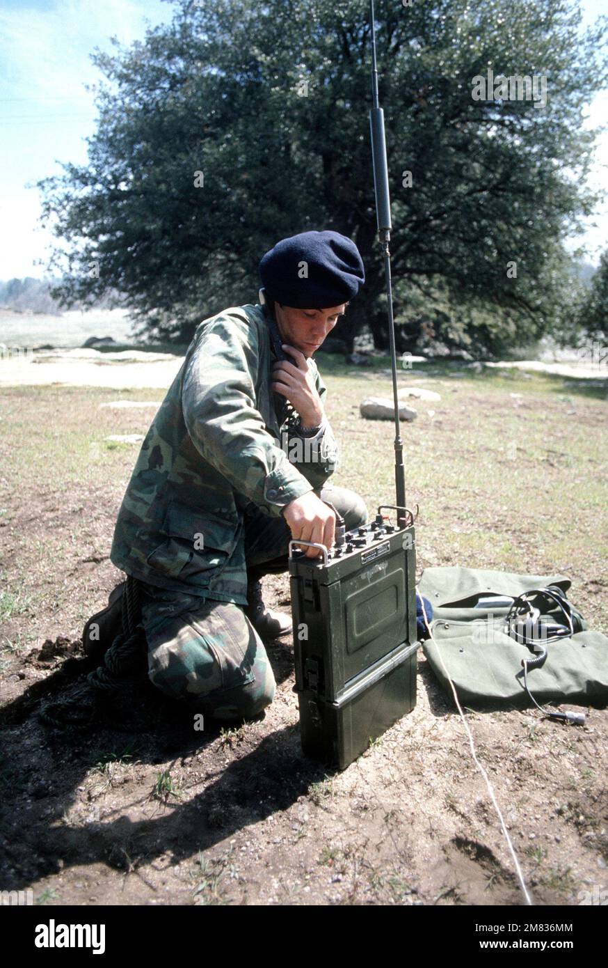 Sergeant (SGT) Dennis L. Walters operates an AN/PRC-74 radio set during ...