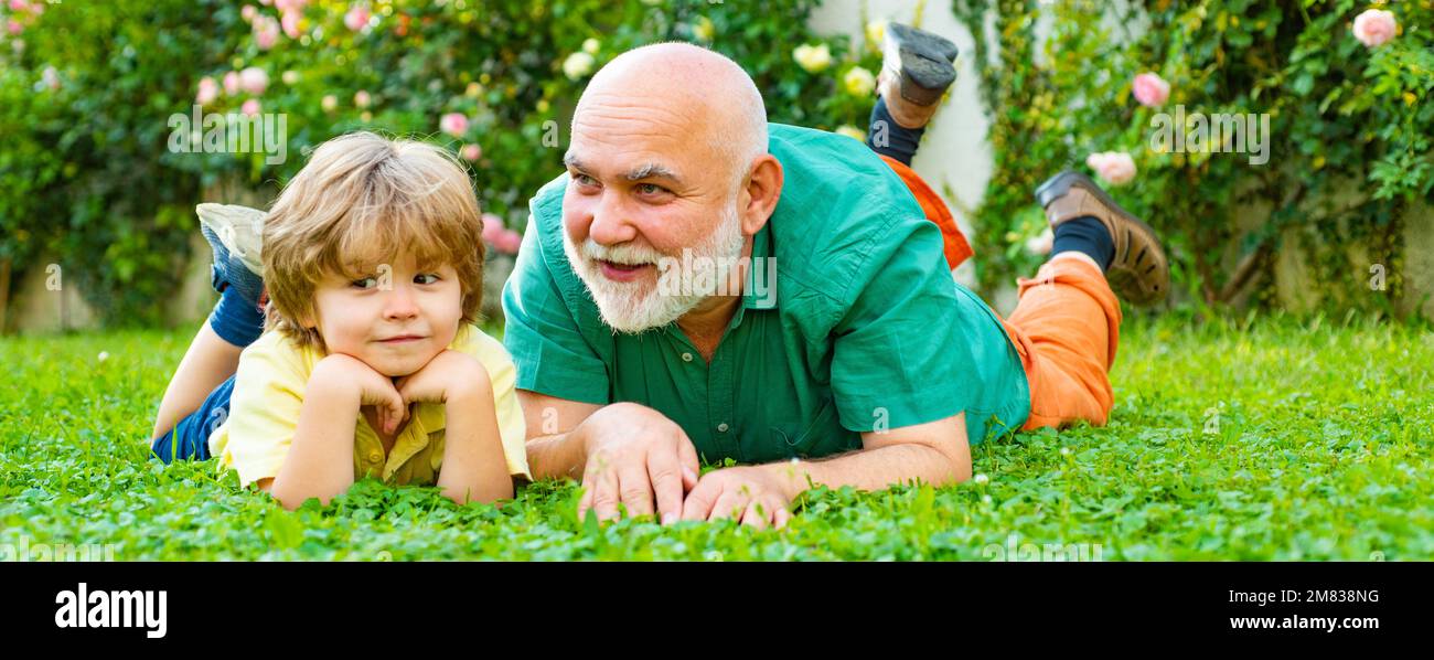 Grandfather and grandson, spring banner. Two different generations ages ...