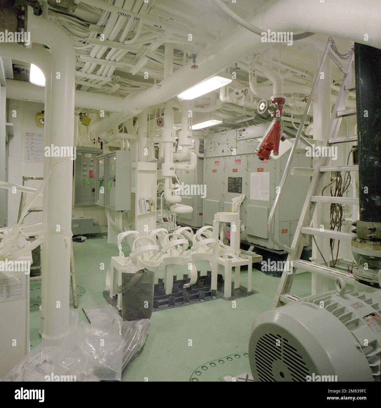 A view of the air conditioning machinery room aboard the guided missile ...