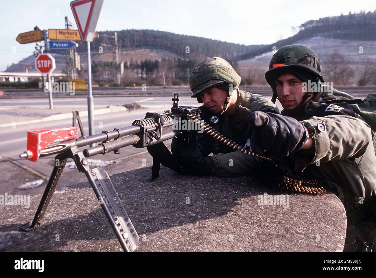 U.S. Army military policemen defend their position with an M-60 machine ...