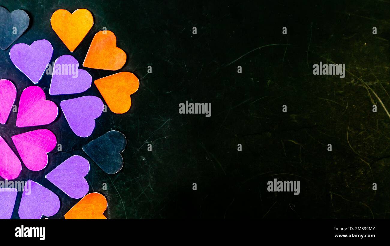 colorful hearts on black background for valentine's day Stock Photo - Alamy