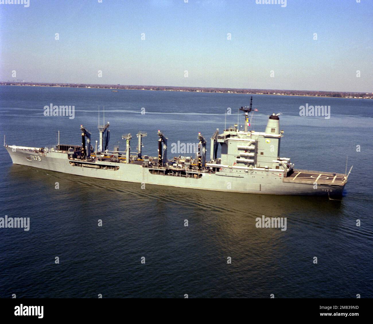 A port beam view of the oiler USS MERRIMACK (AO-179) underway in ...