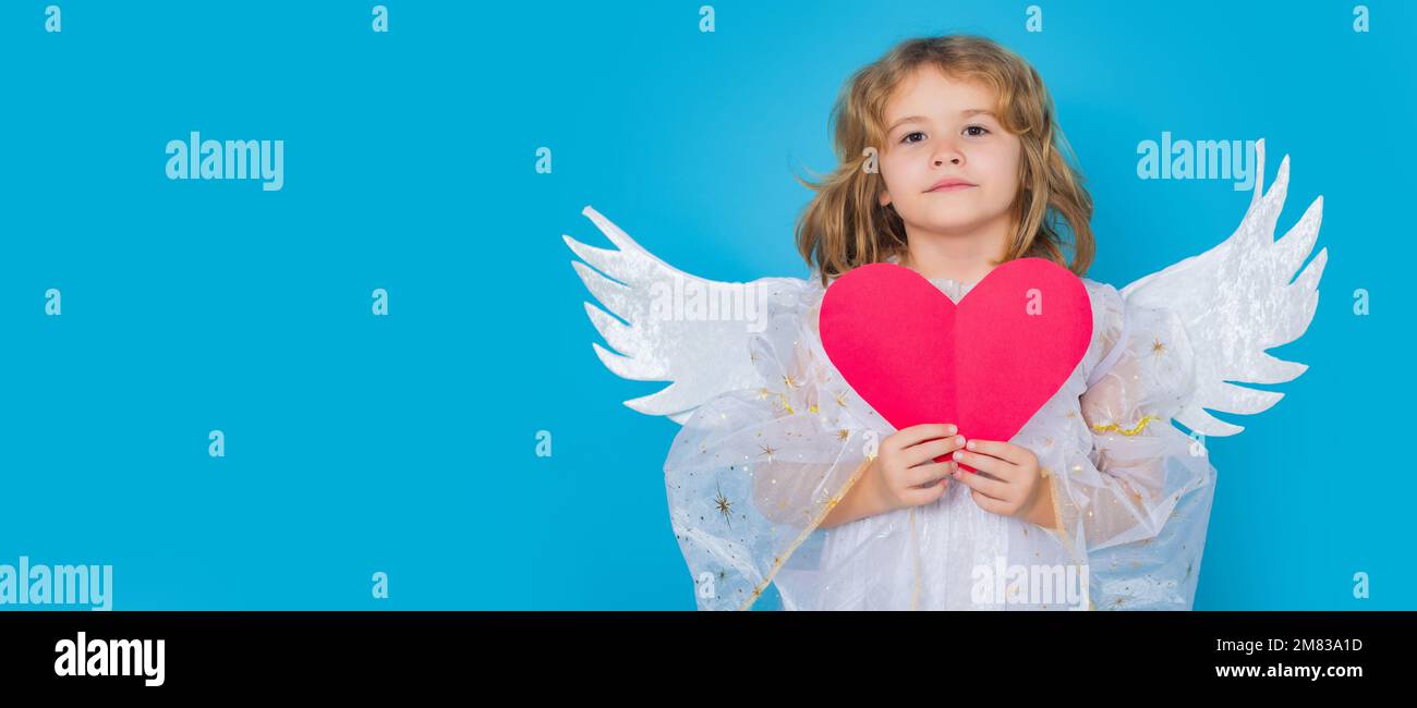 Angel kid with heart. Kid wearing angel costume white dress and feather ...