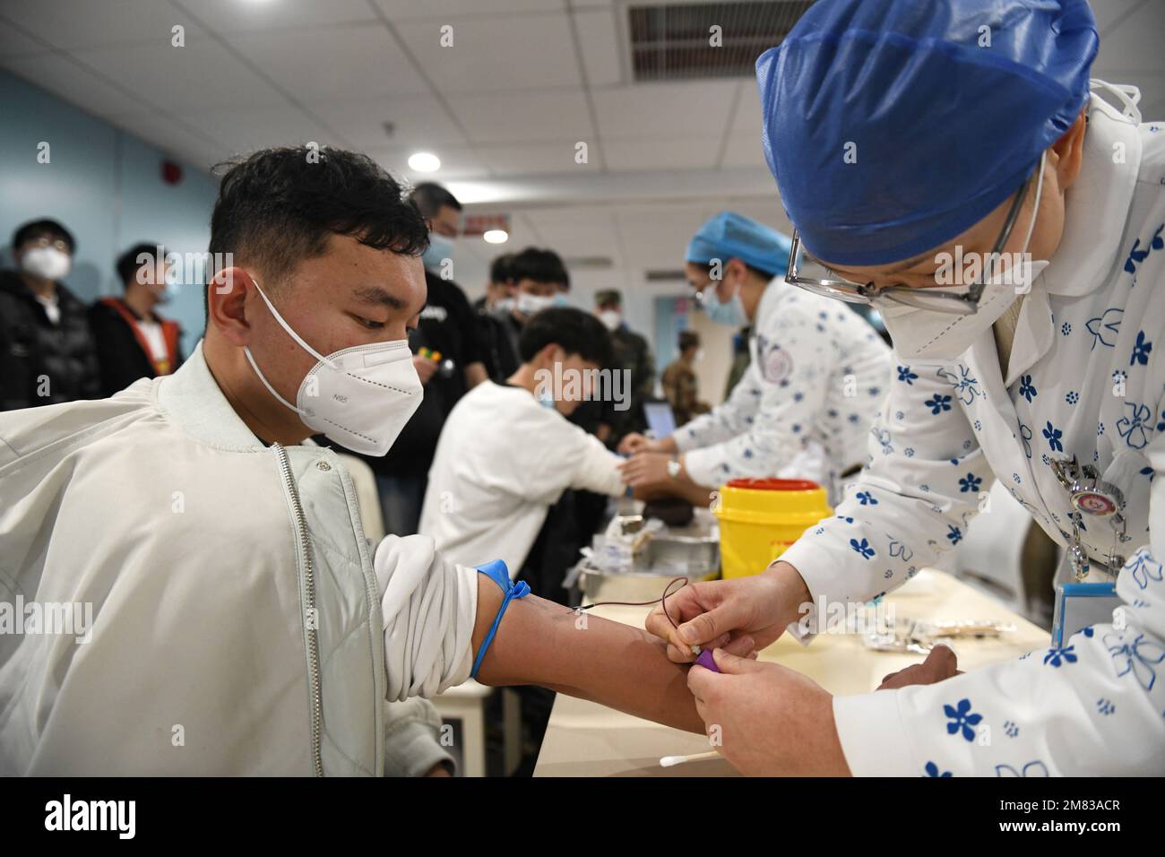 FUYANG, CHINA - JANUARY 12, 2023 - 200 college graduates take part in a ...