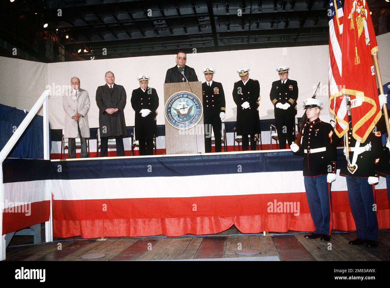 Guests of honor stand as CAPT. Michael P. O'Neil, chaplain, gives the ...