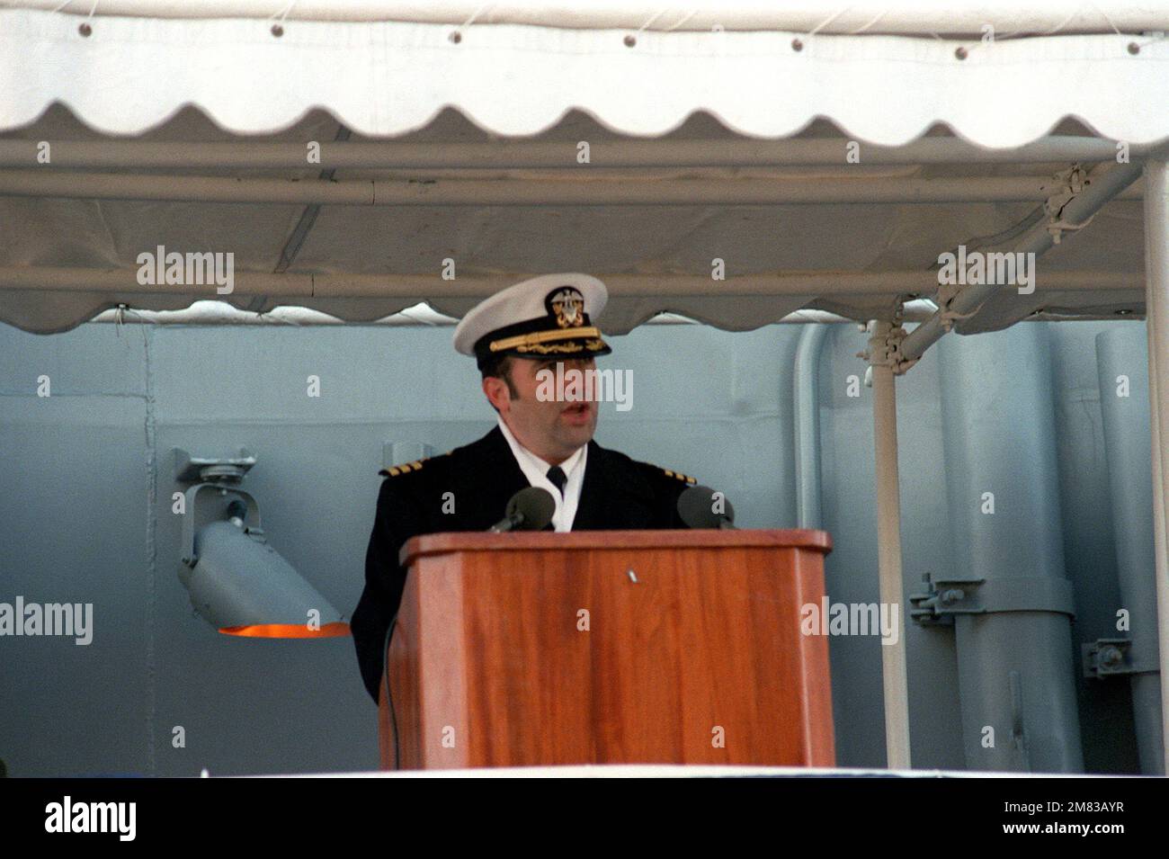 CMDR. Charles E. Bourke, Chaplain Corps, gives the invocation during ...