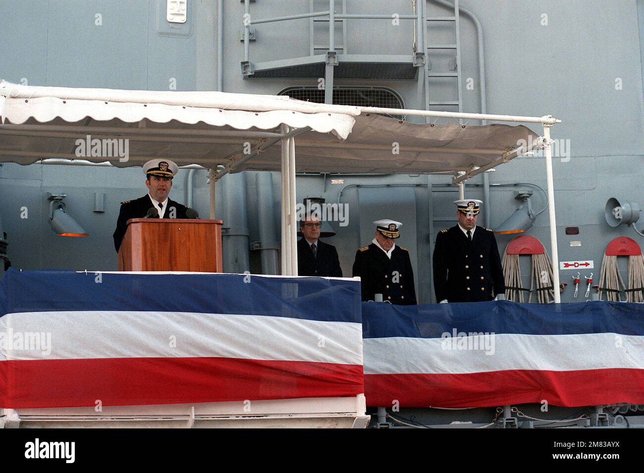 Guests of honor bow their heads as CMDR. Charles E. Bourke, Chaplain ...