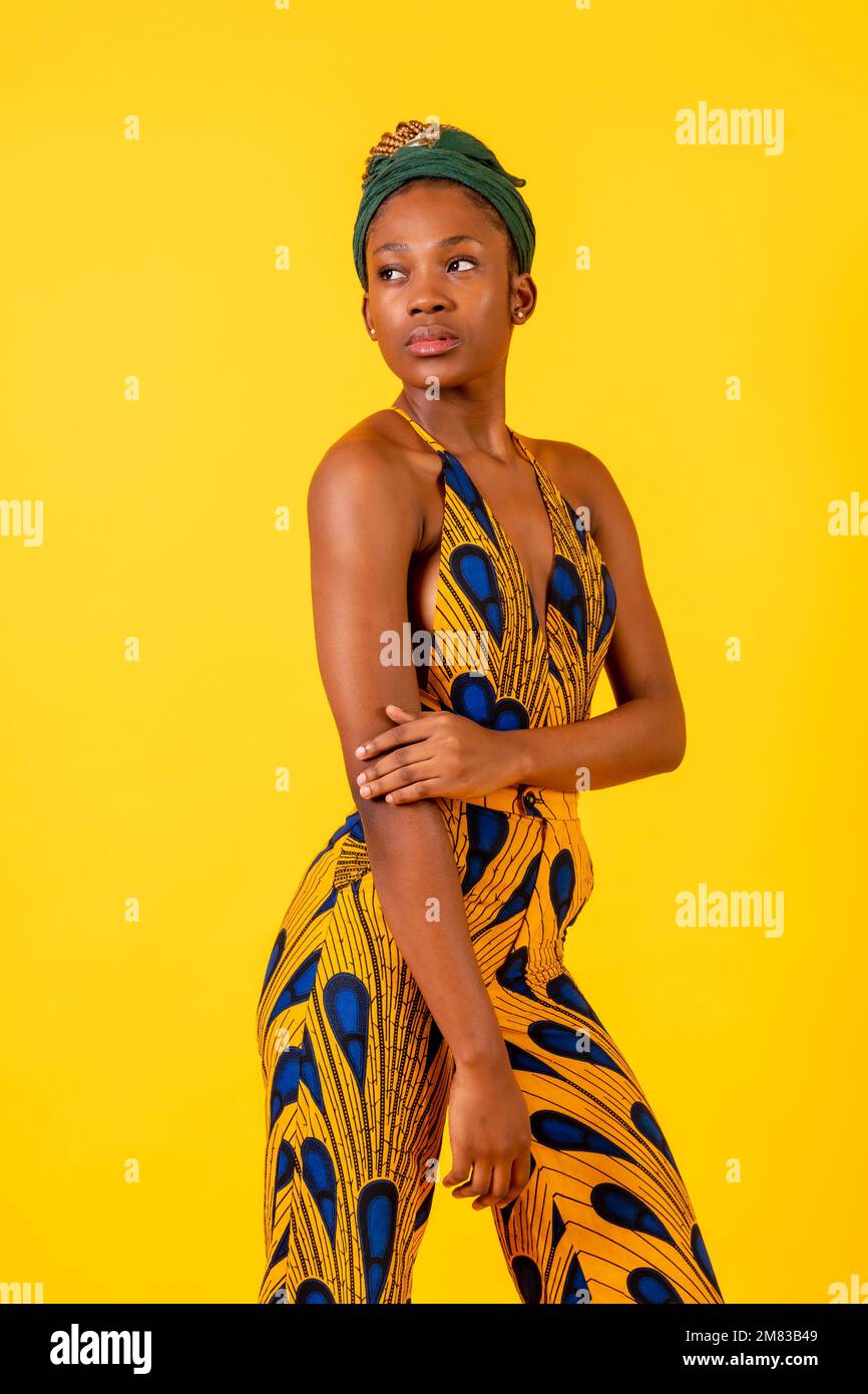 An African woman wearing traditional African costume and posing in ...