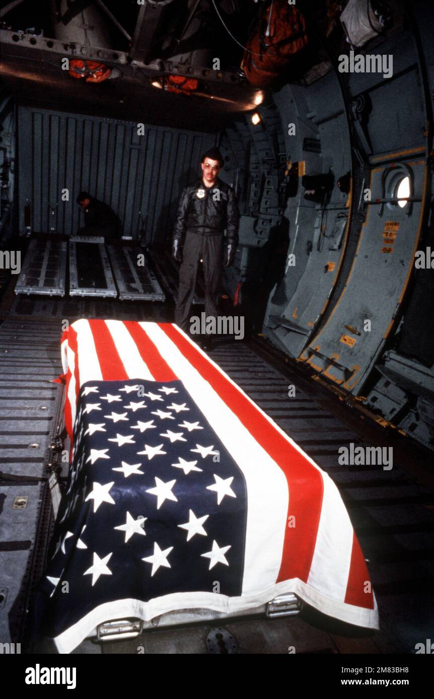 The flag draped coffin containing the body of MAJ Arthur D. Nicholson ...