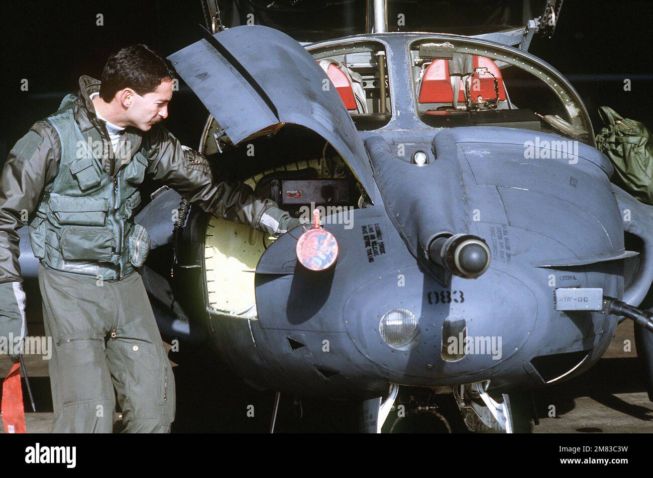 A 19th Tactical Air Support Squadron pilot checks his OA-37 Dragonfly ...