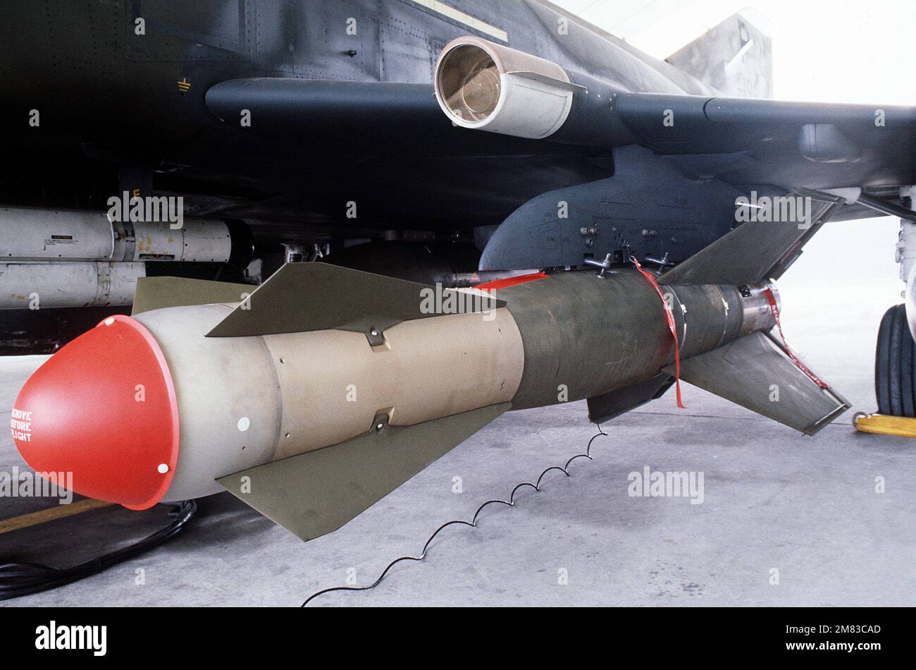 A GBU-15 modular glide bomb mounted on the wing pylon of a 3rd Tactical ...