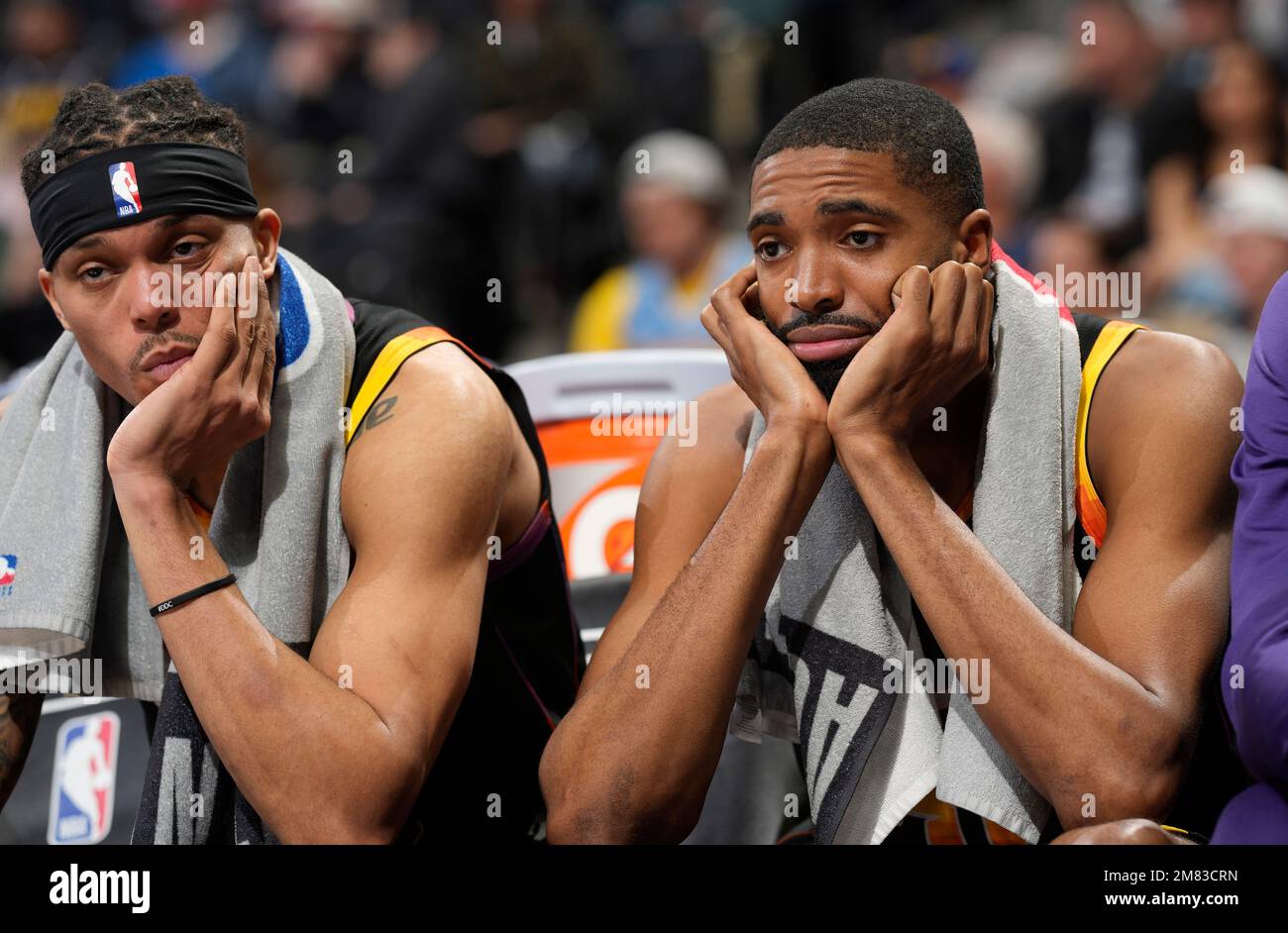 Phoenix Suns guard Damion Lee, left, and forward Mikal Bridges watcher ...