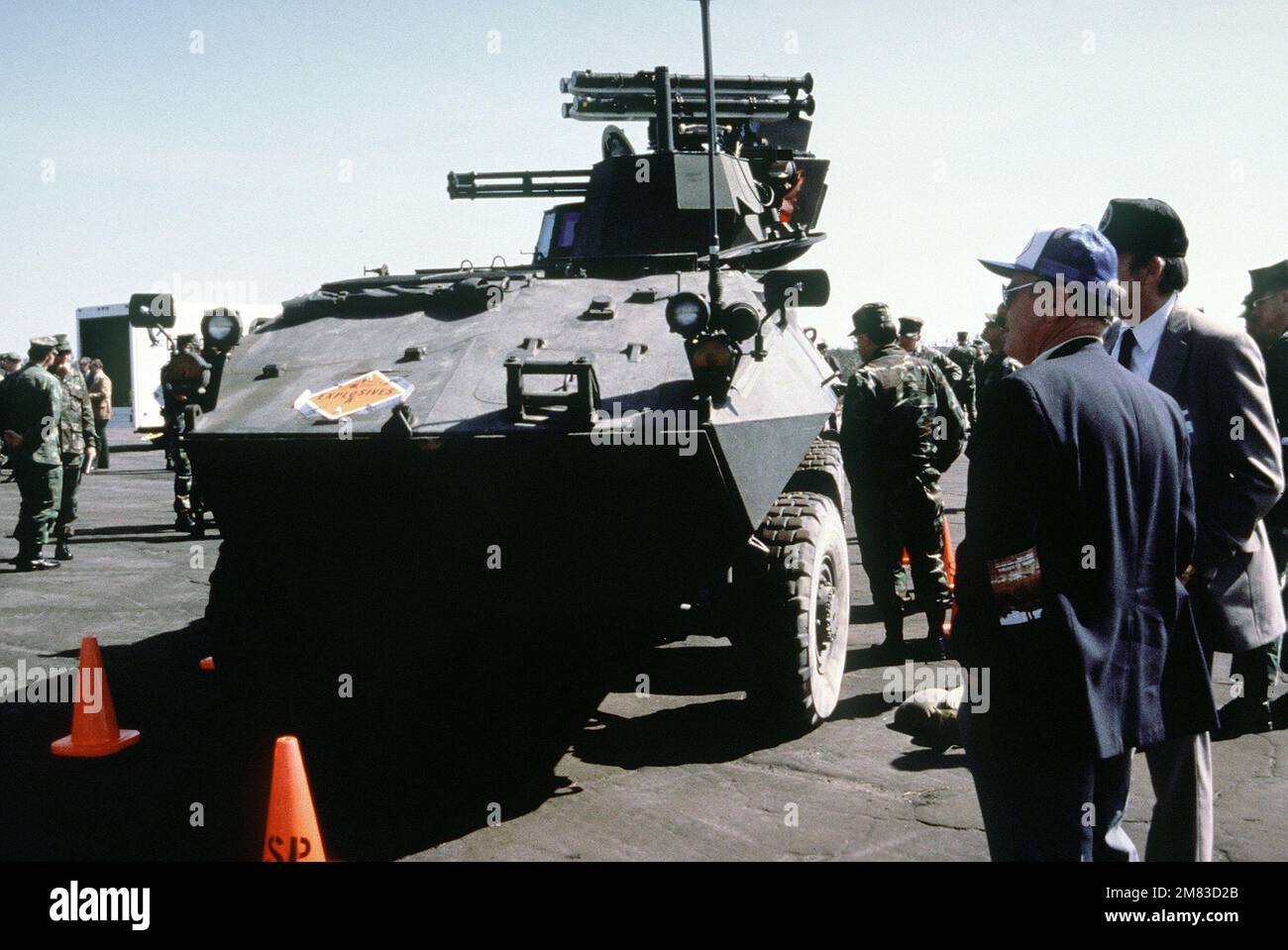 Marines inspect an LAV-25 light armored vehicle equipped with a GAU-13 ...