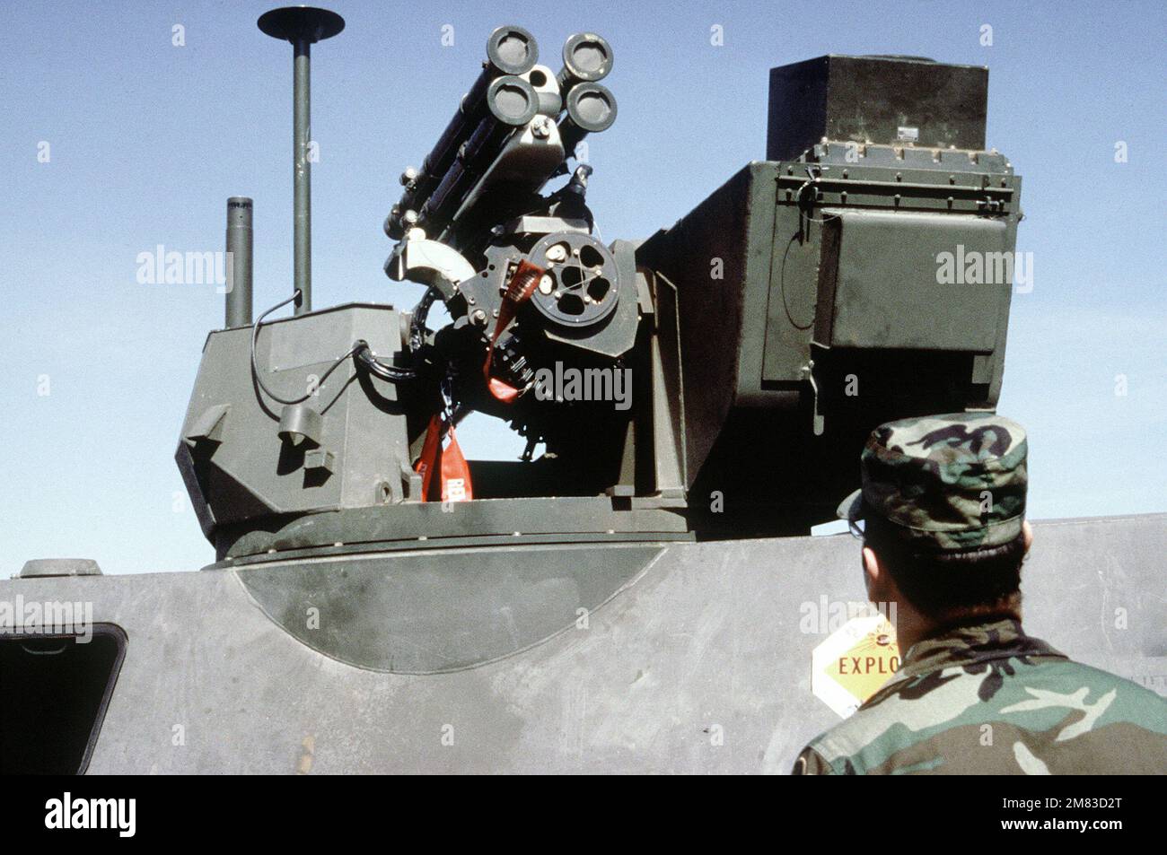 A Marine looks at the turret of an LAV-25 light armored vehicle ...