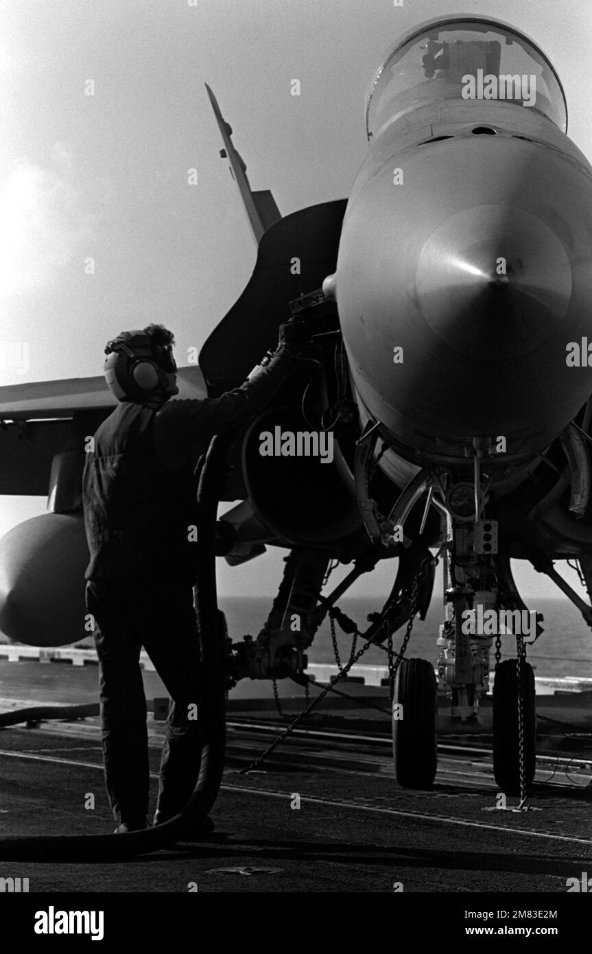 An F/A-18 aircraft from Strike-Fighter Squadron 25 (VFA-25) is fueled ...