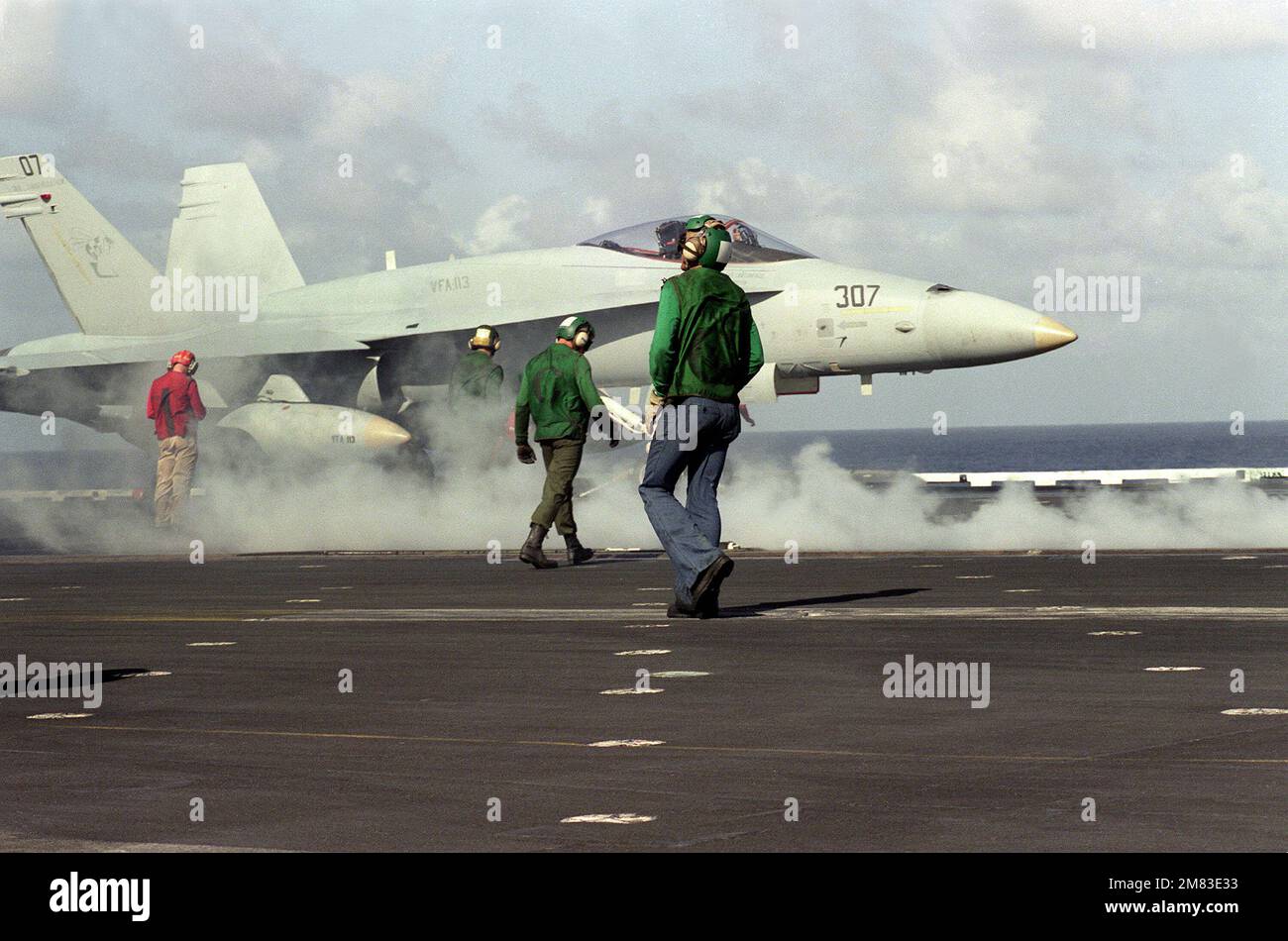 Crewmembers aboard the aircraft carrier USS CONSTELLATION (CV-64 ...