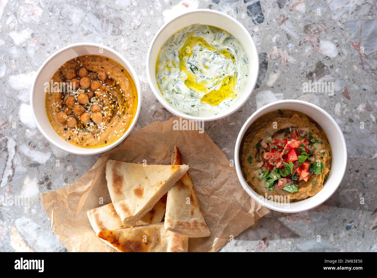 Pita with assorted traditional greek dips, tzatziki, vegetable caviar ...