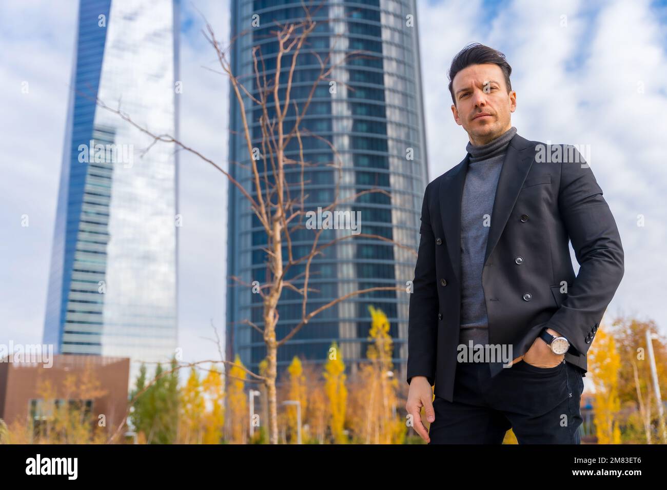 A Caucasian businessman standing in front of building Stock Photo - Alamy