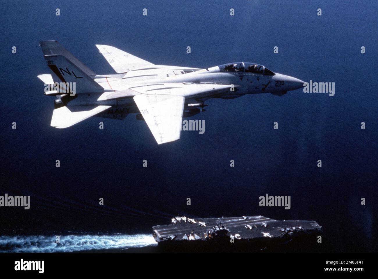 An air-to-air right side view of an F-14 Tomcat aircraft from Fighter ...