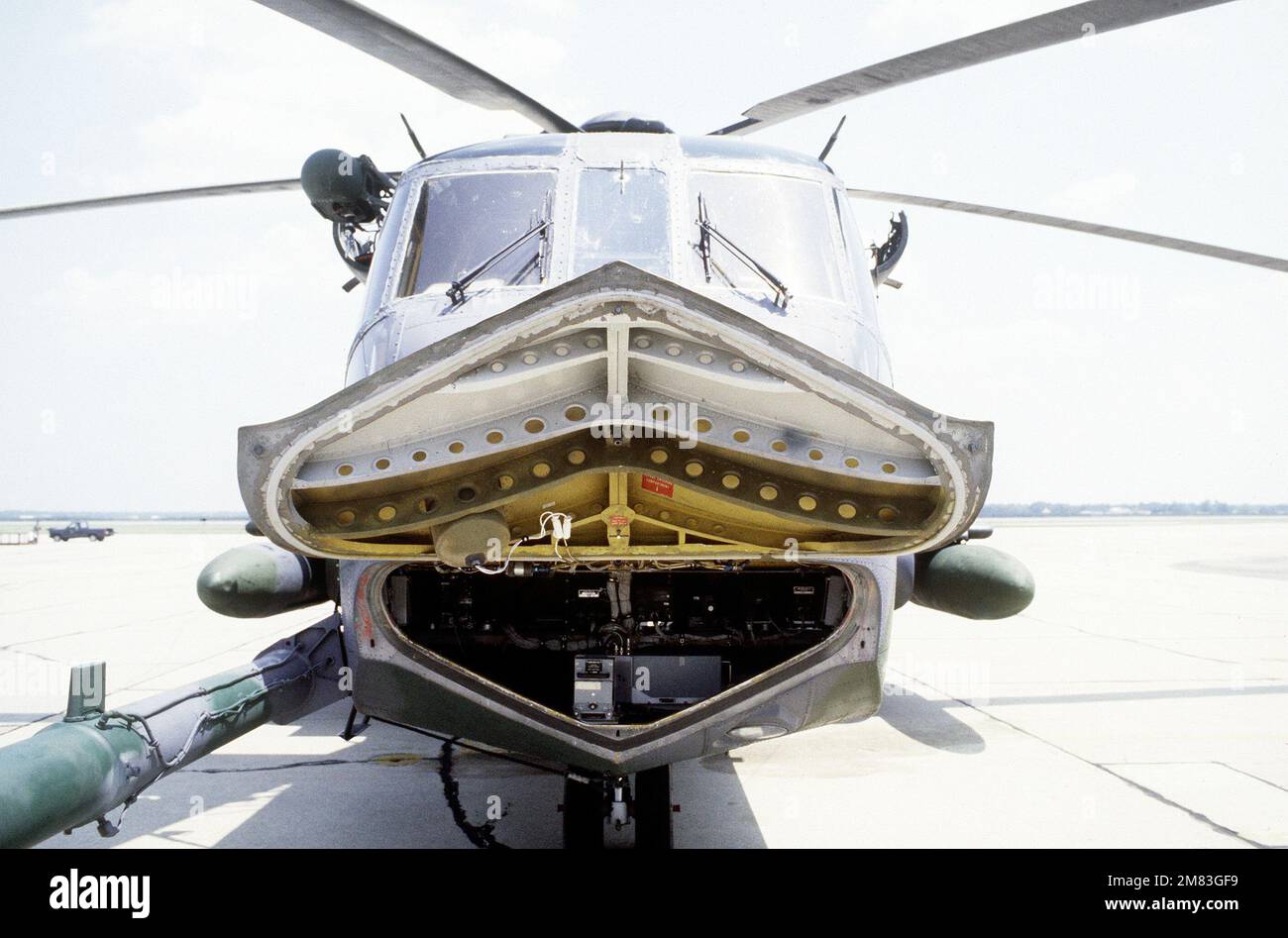 A service hatch is opened aboard an HH-3 Jolly Green Giant helicopter ...