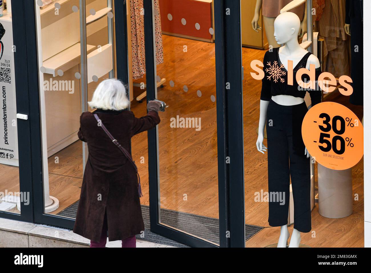 Posters in various French stores, start of the shopping season with ...