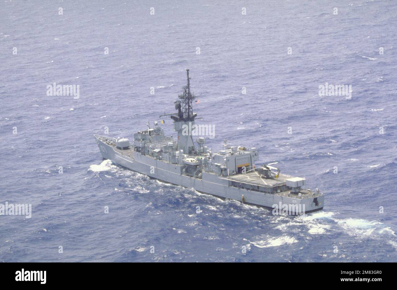 A port quarter view of the frigate USS BADGER (FF-1071) underway ...