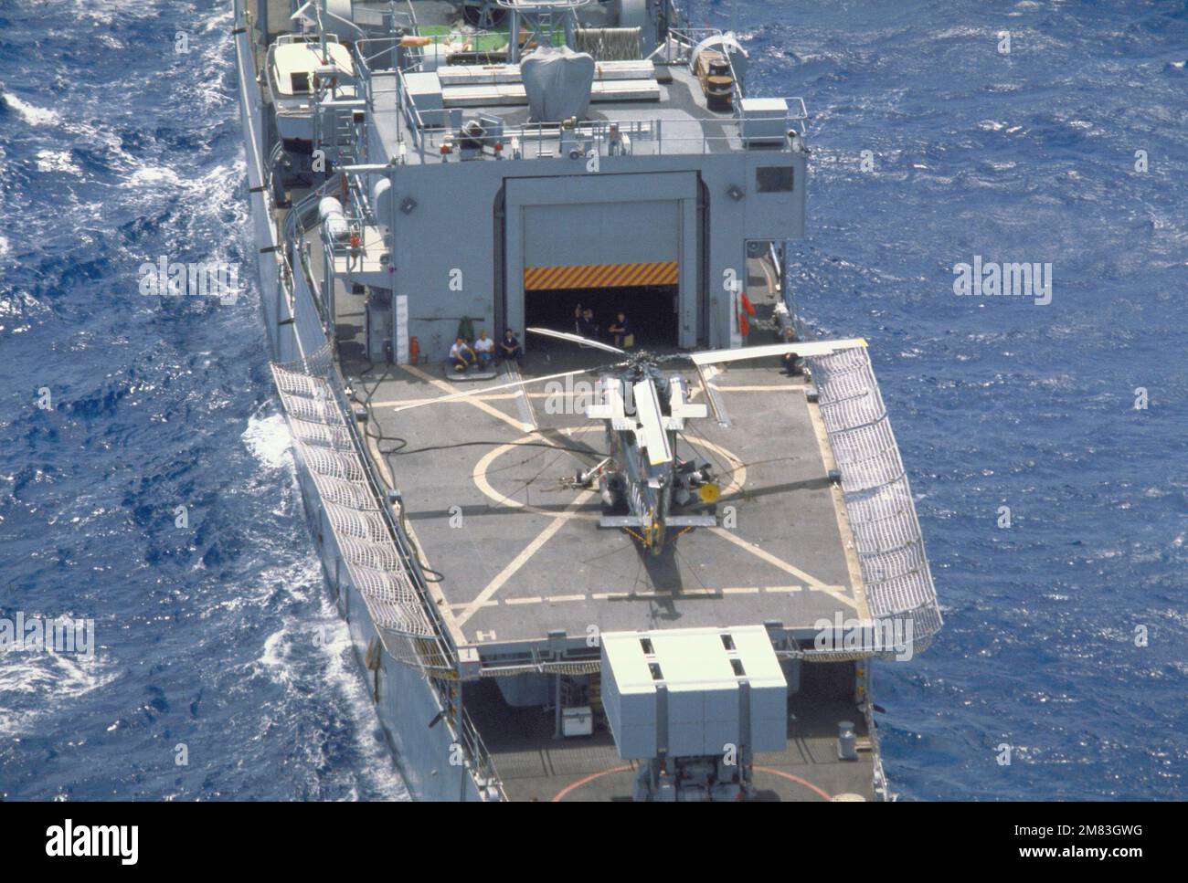 An elevated view of the helicopter deck of the frigate USS BADGER (FF ...