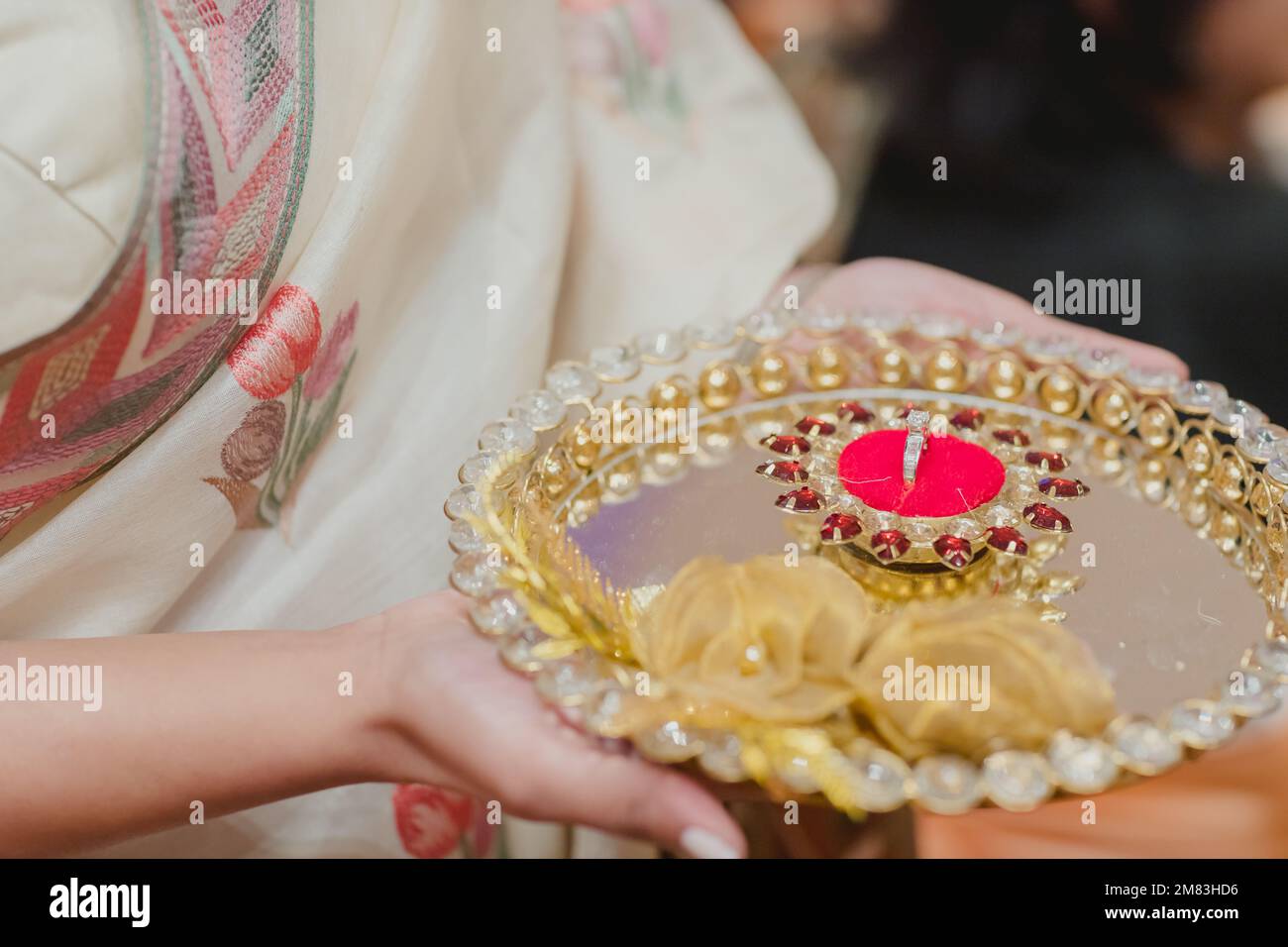 Indian bride holding traditional thali couple wedding engagement rings ...