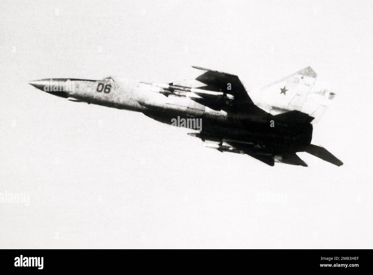 An air-to-air left side view of a Soviet MiG-25 Foxbat-E aircraft with ...