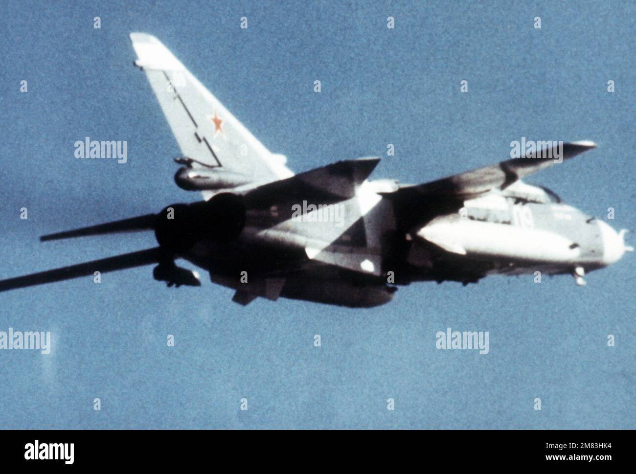 A right rear view of a Soviet Su-24 Fencer fighter-bomber aircraft in ...