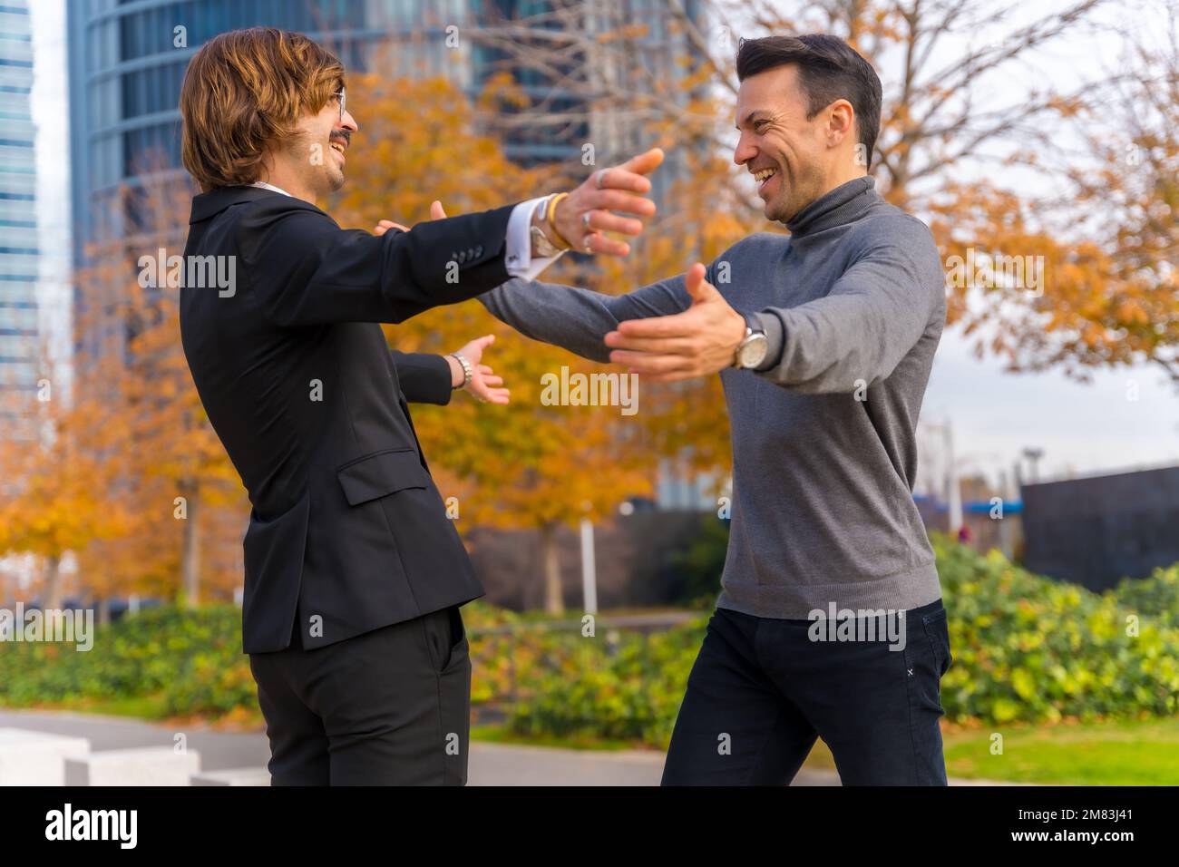 A scenic view of two caucasian businessmen greeting each other outside ...