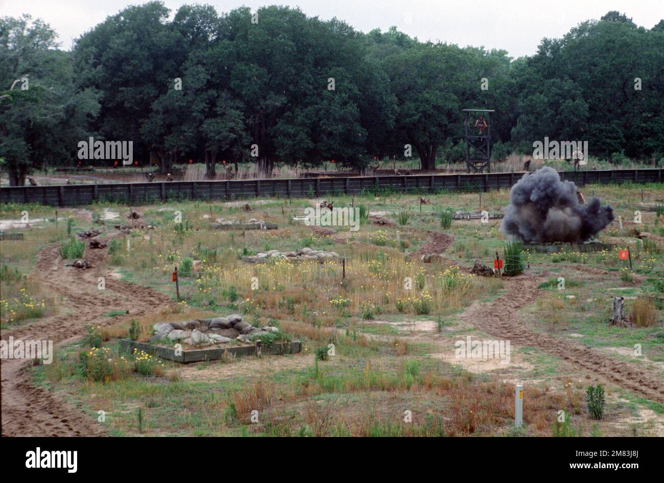 Marine recruits train on an infiltration course during basic training ...
