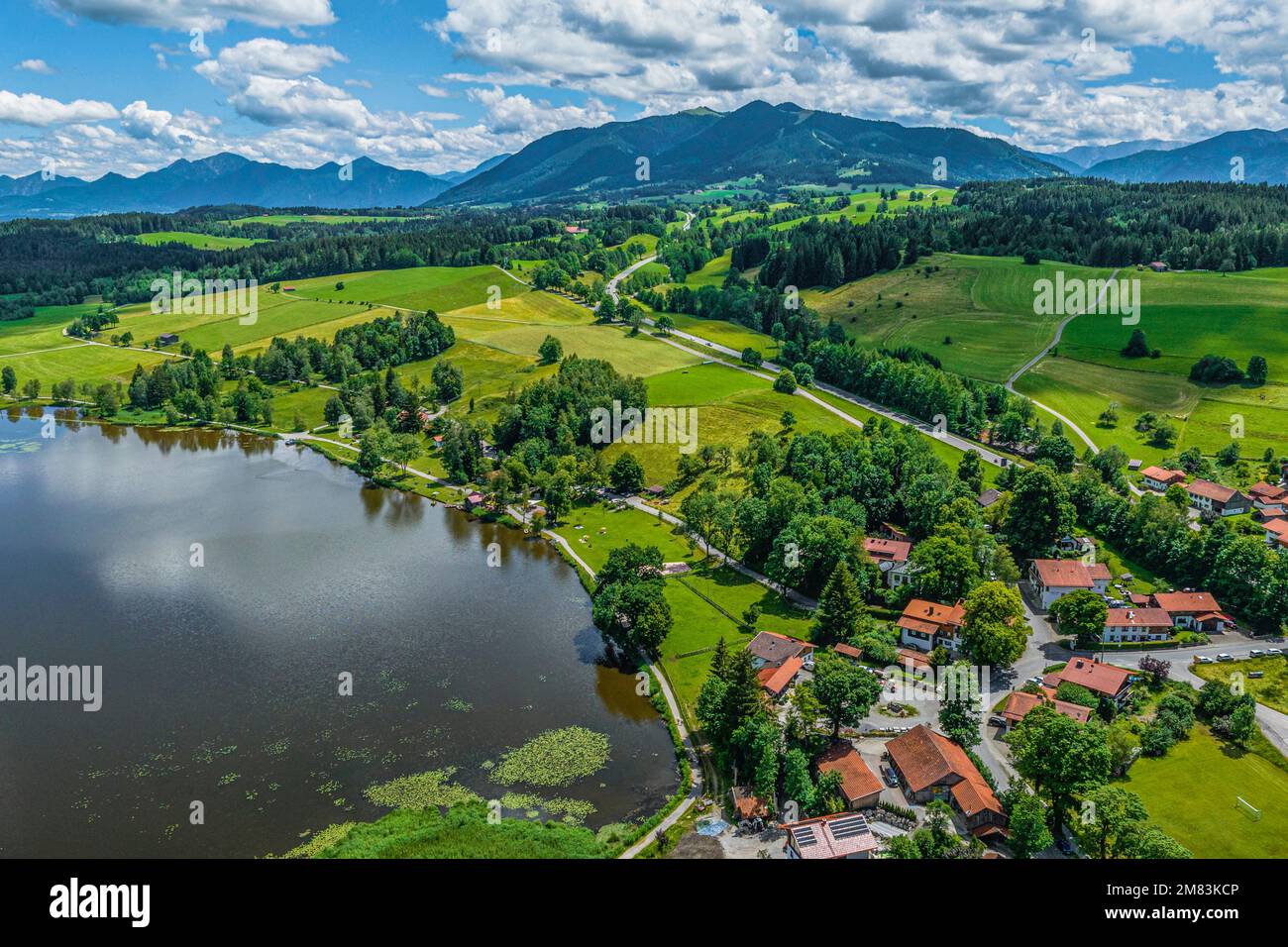 Aerial view to the beautiful upper bavarian village of Bayersoien and ...