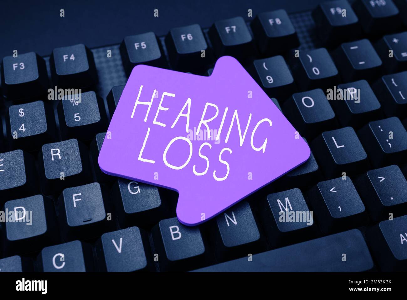 Hand writing sign Hearing Loss. Conceptual photo is partial or total ...