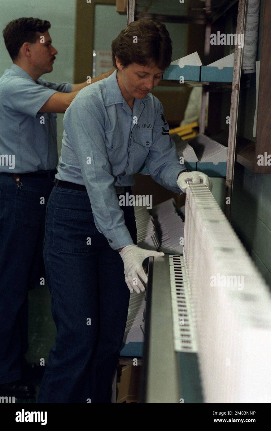 PH2 Mark Heim and PH2 Elizabeth Antonio work with duplicate slides in ...