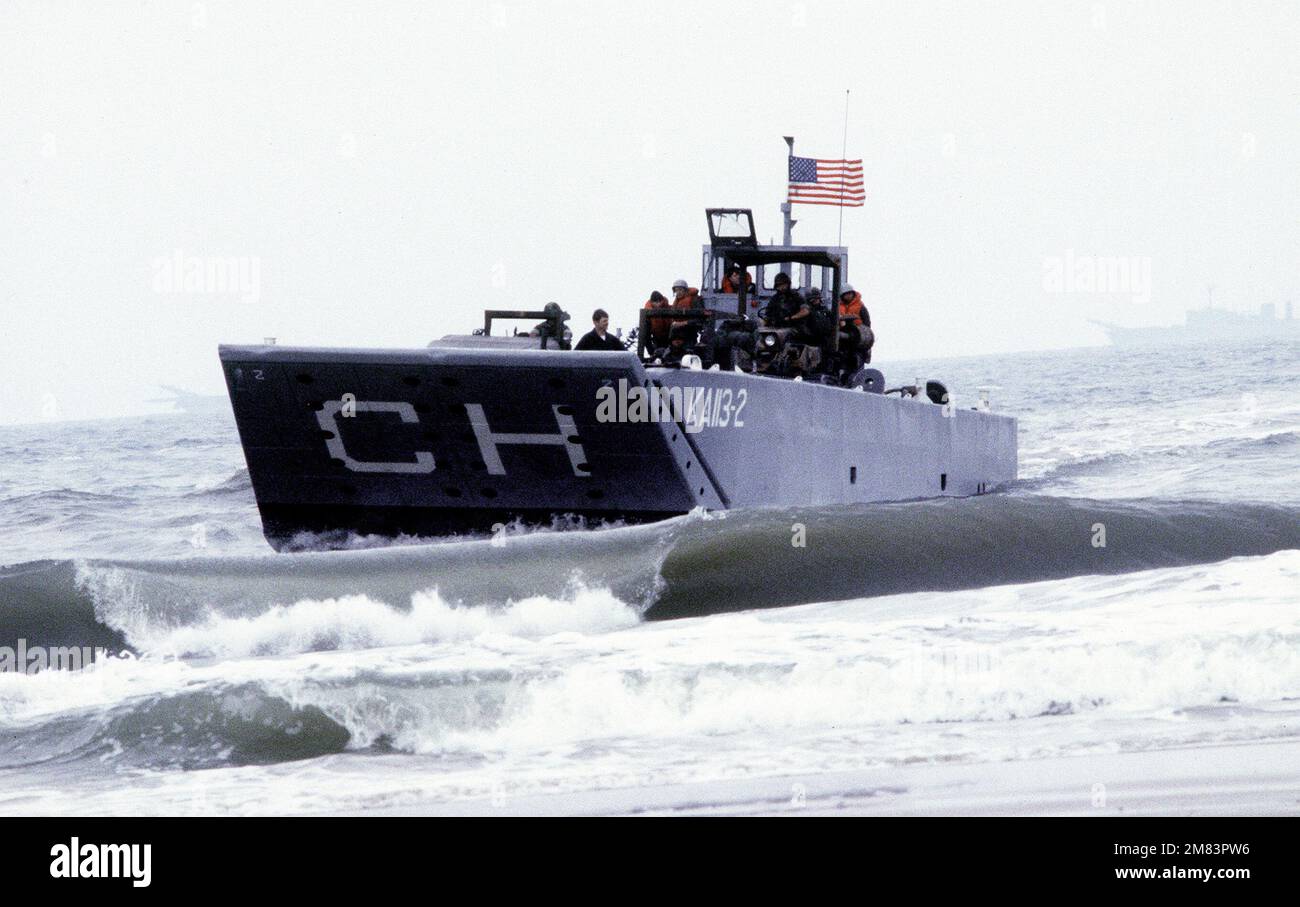 An LCM-8 Mod-1 mechanized landing craft lands at Onslow Beach during ...