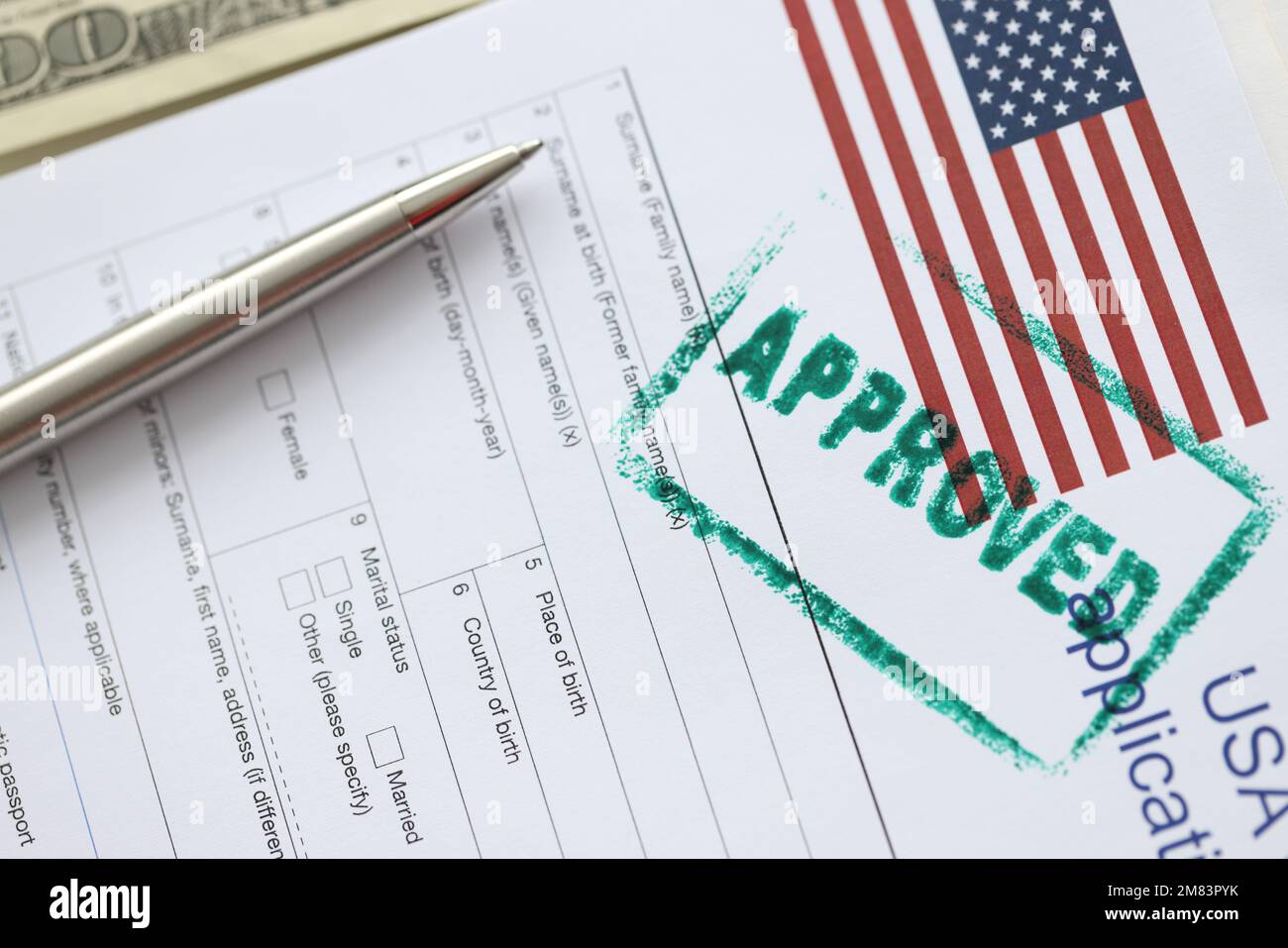 USA visa approved rubber stamp and application form Stock Photo - Alamy