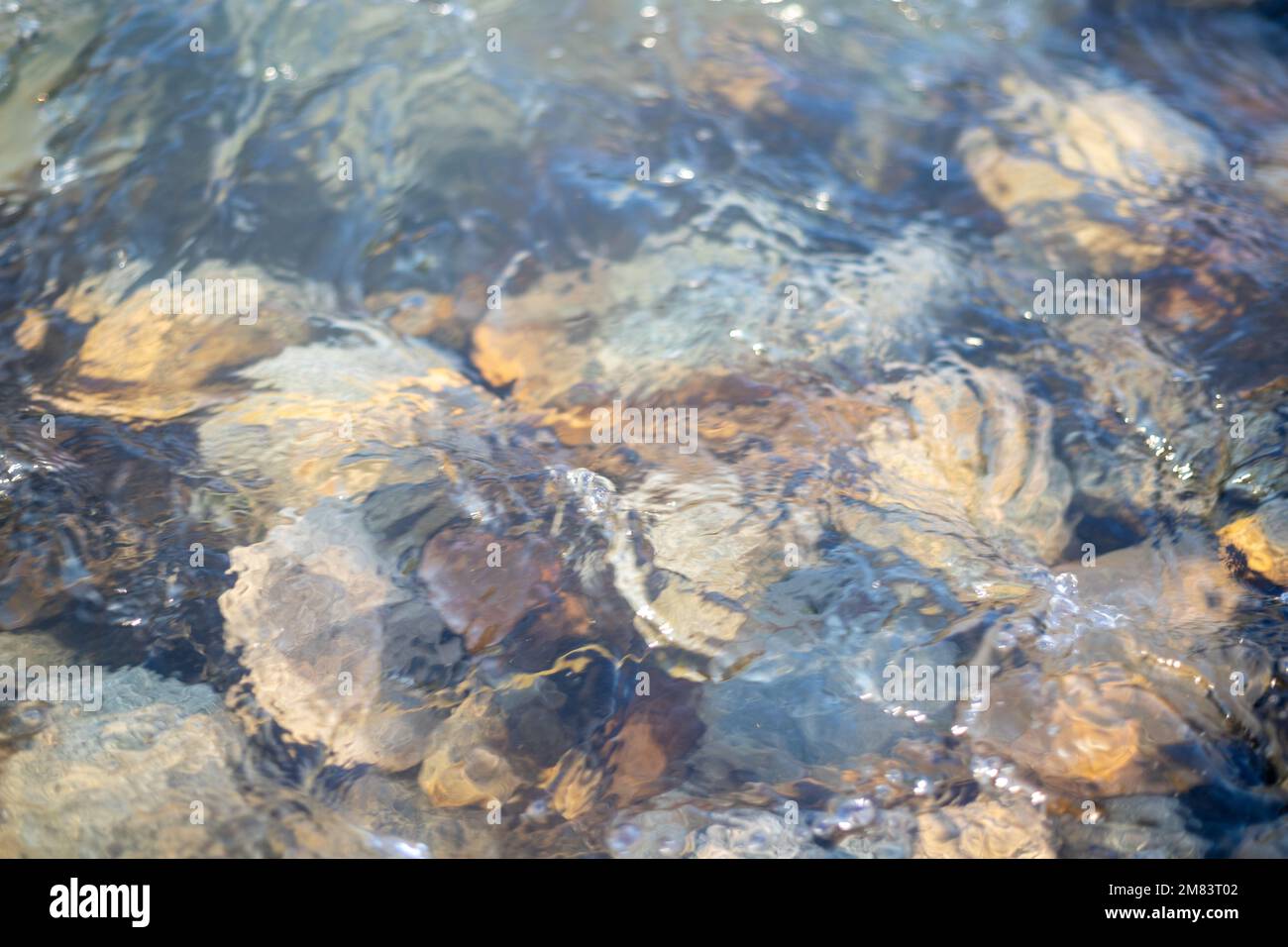 Crystal clear clean and see through water with clear pebble of the ...