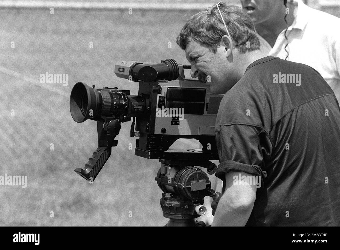 An audiovisual specialist sets up a video camera to record the transit ...
