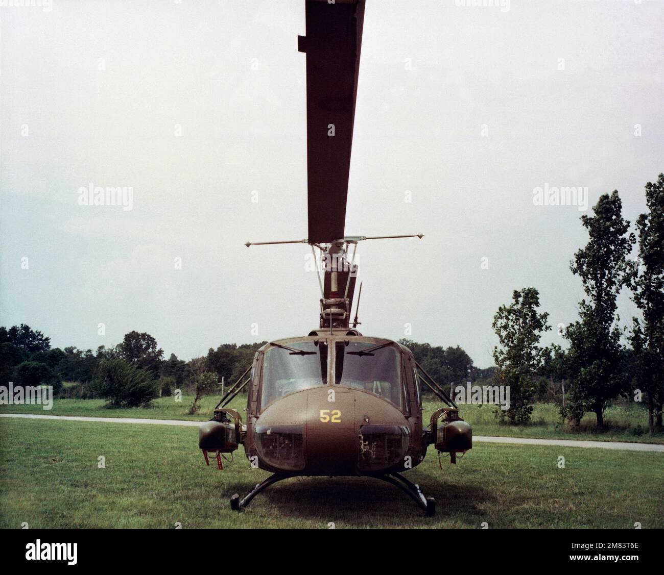 A front view of a UH-1 Iroquois helicopter equipped with an M-56 ...