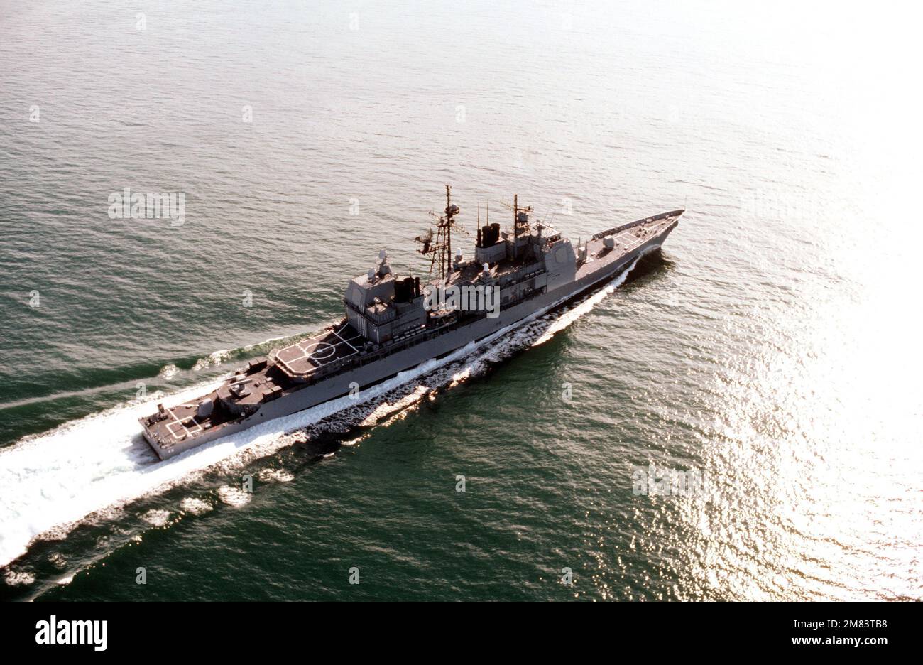 An elevated starboard quarter view of the guided missile cruiser USS ...