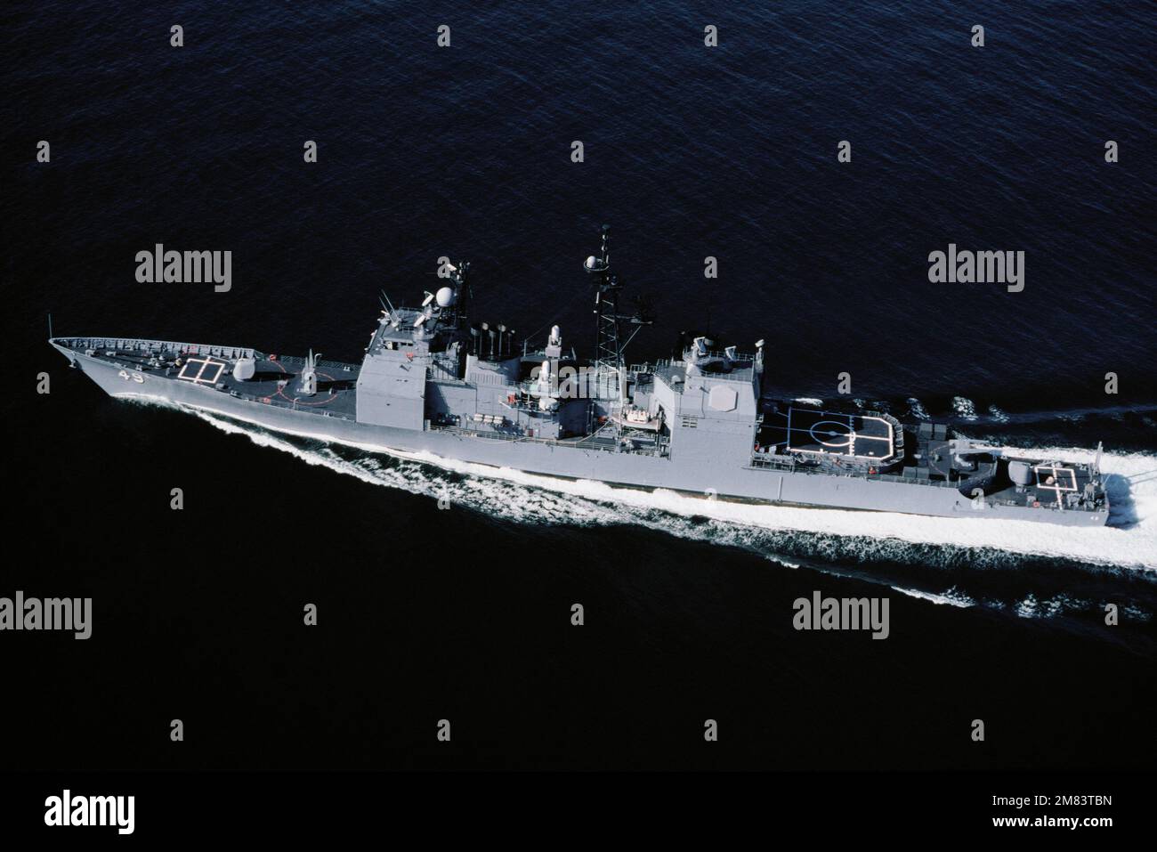 An aerial port view of the guided missile cruiser USS VINCENNES (CG 49 ...