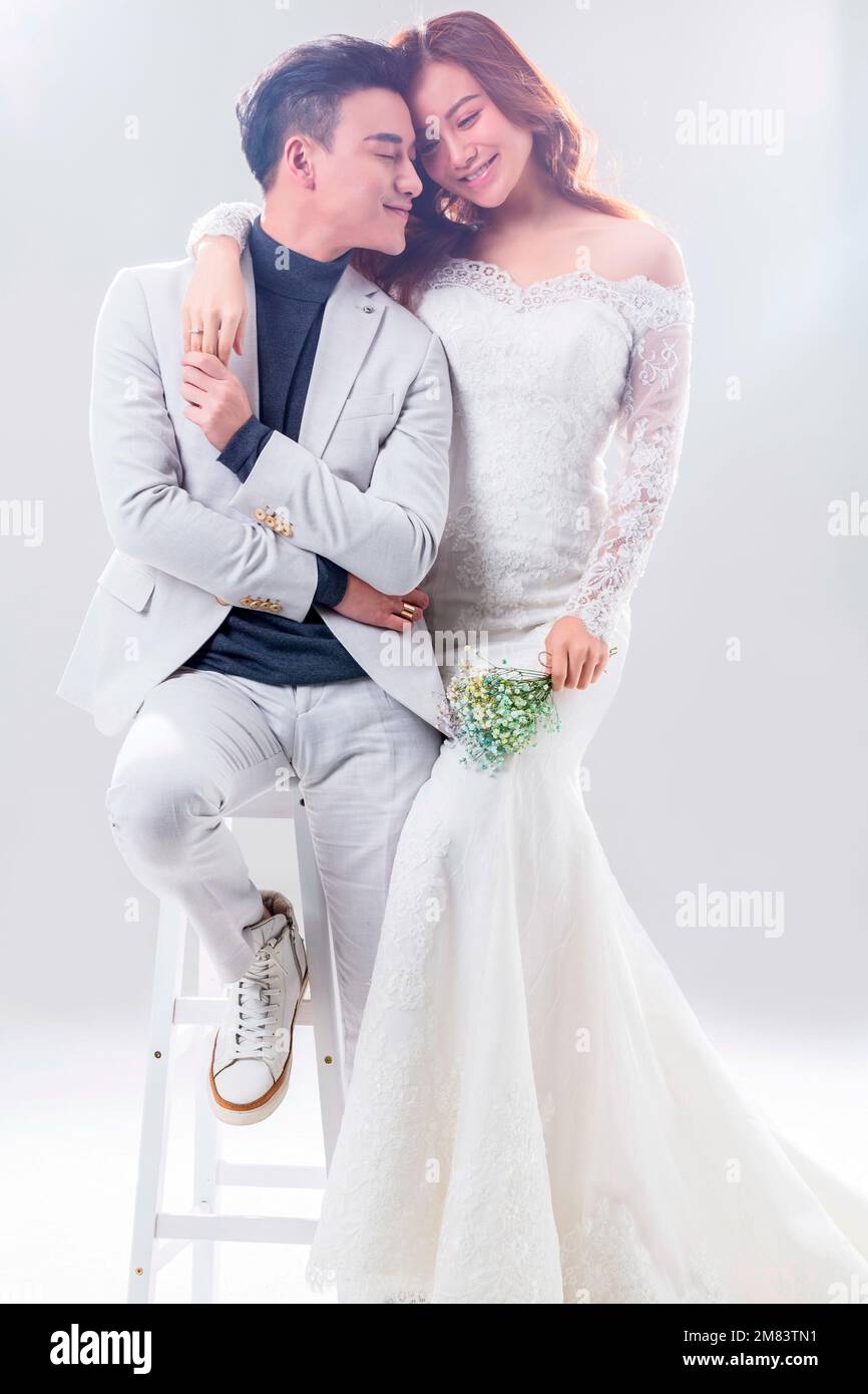 Happy and sweet bride and groom Stock Photo - Alamy