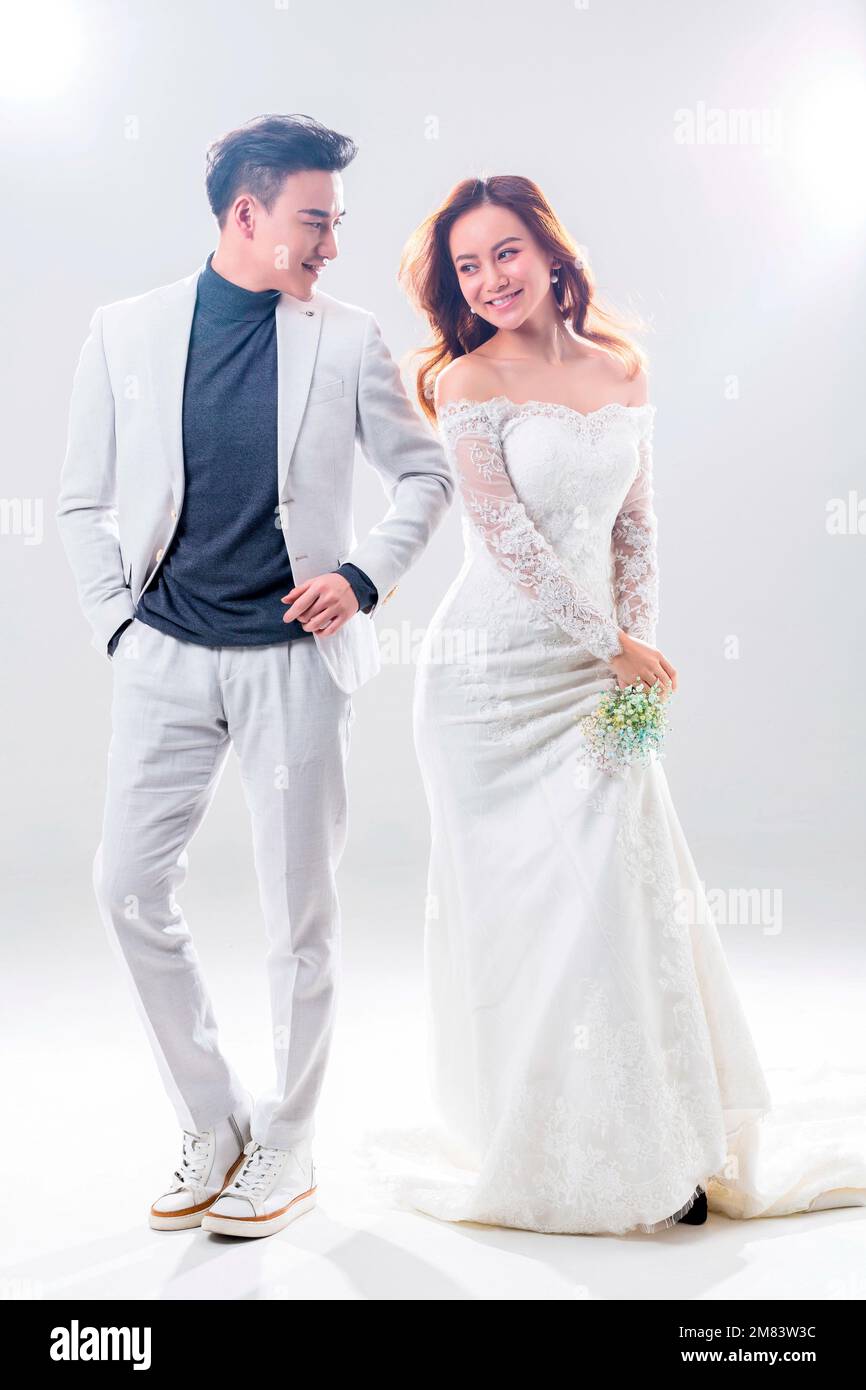 Happy and sweet bride and groom Stock Photo - Alamy