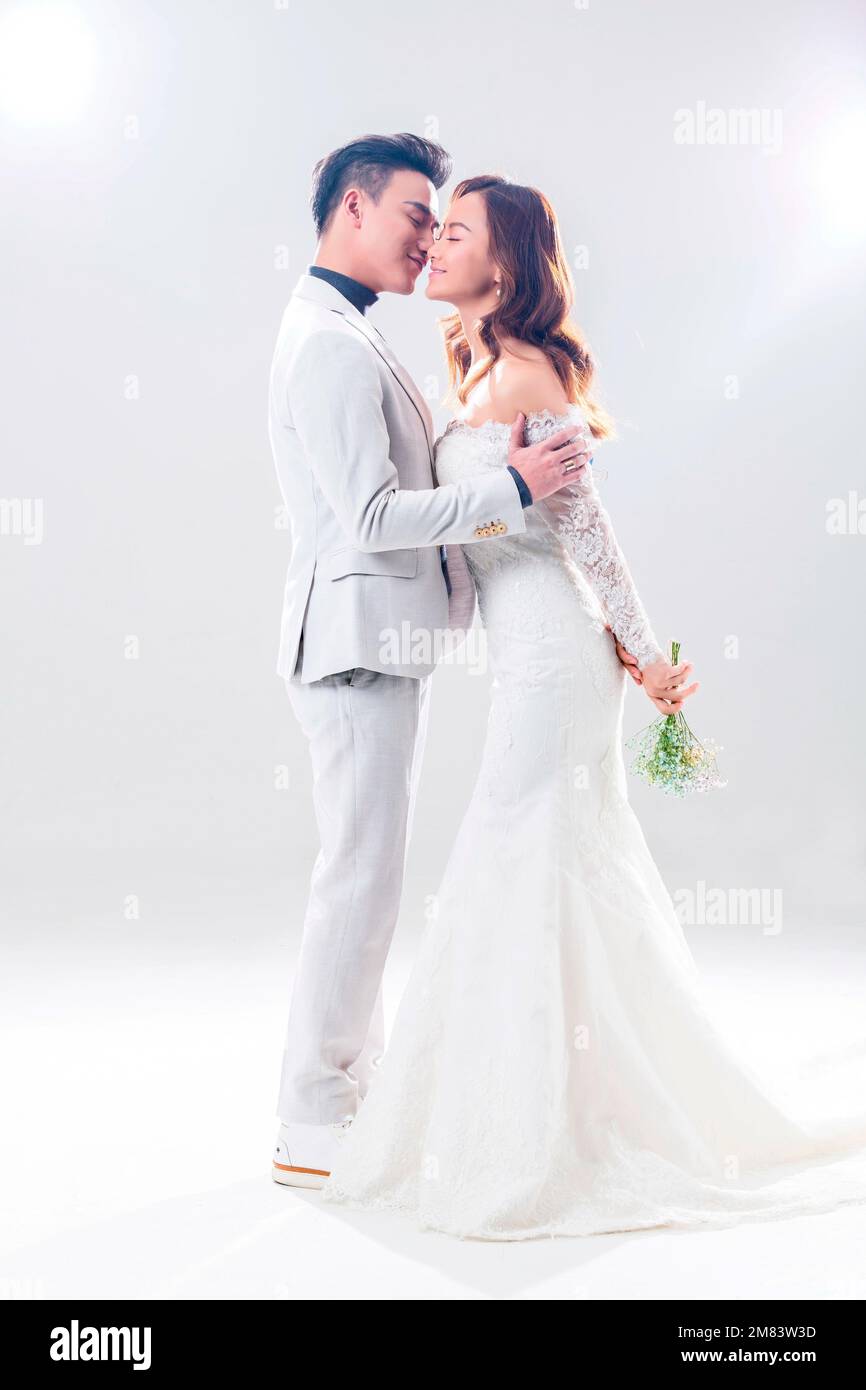 Happy and sweet bride and groom Stock Photo - Alamy