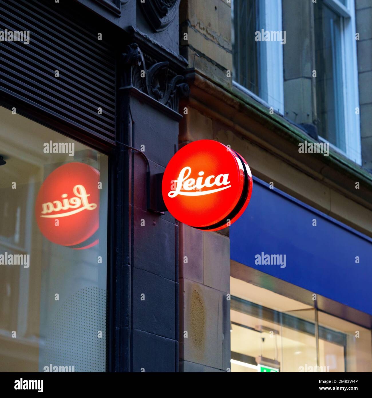 Leica camera logo sign on the outside of camera store reflecting in the ...