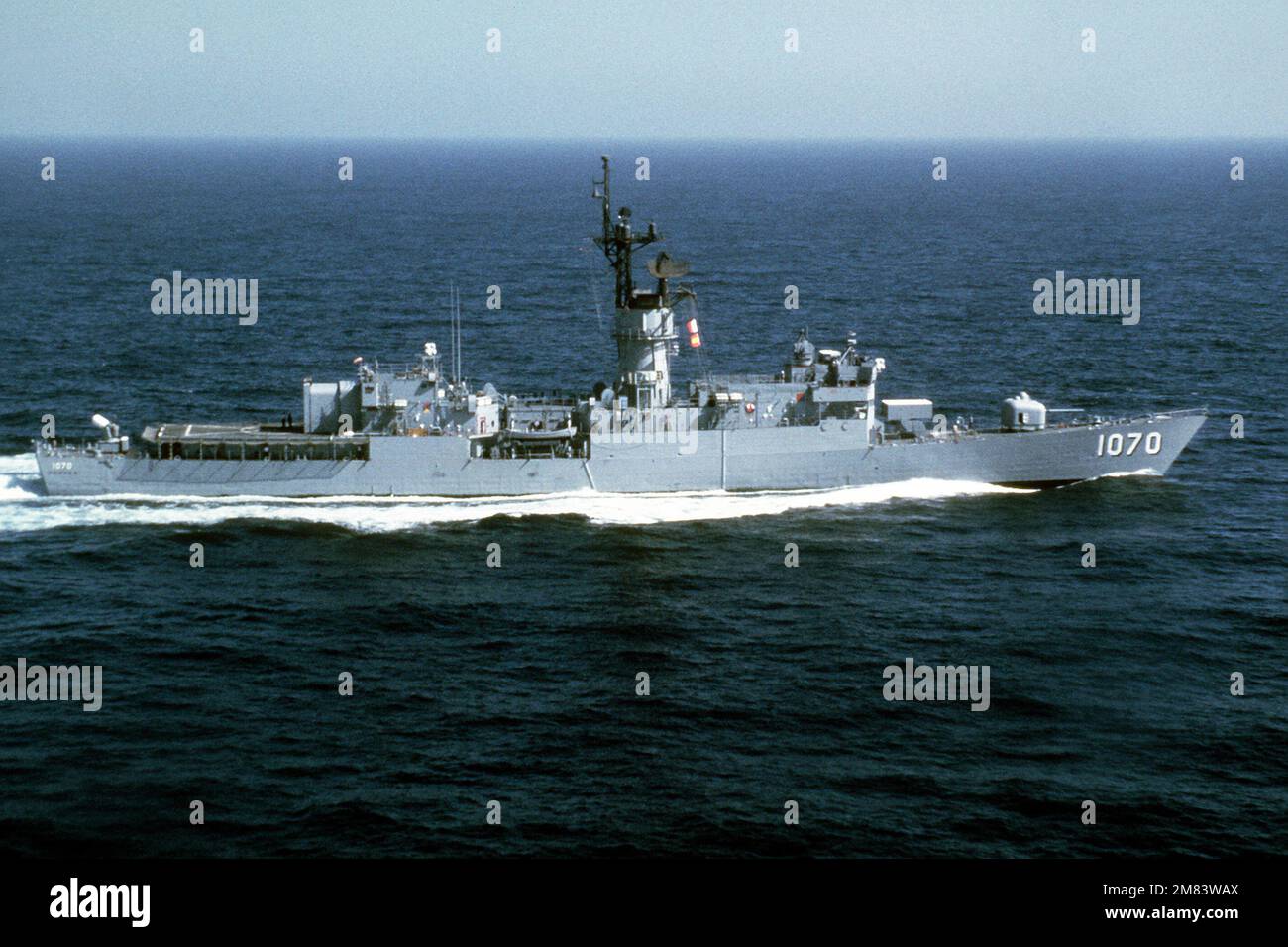 An elevated starboard beam view of the frigate USS DOWNES (FF-1070 ...