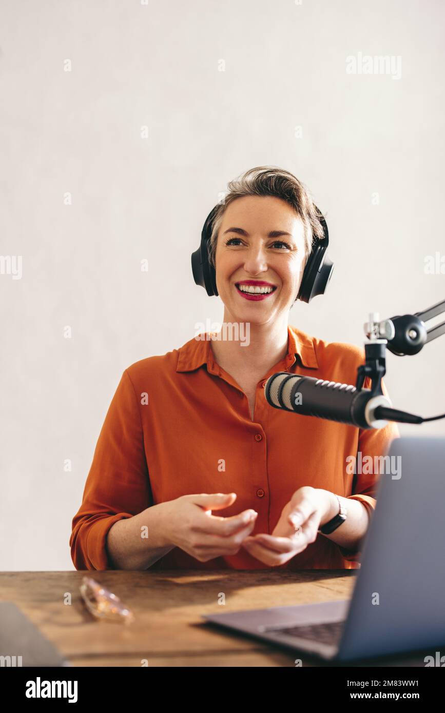 Sitting behind a microphone hi-res stock photography and images - Alamy